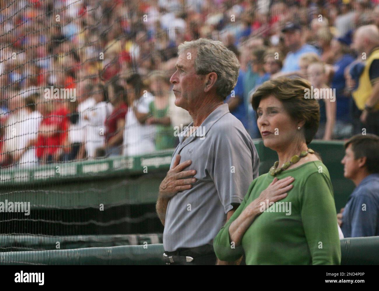 Former President George W. Bush his wife, Laura Bush, stand during the ...