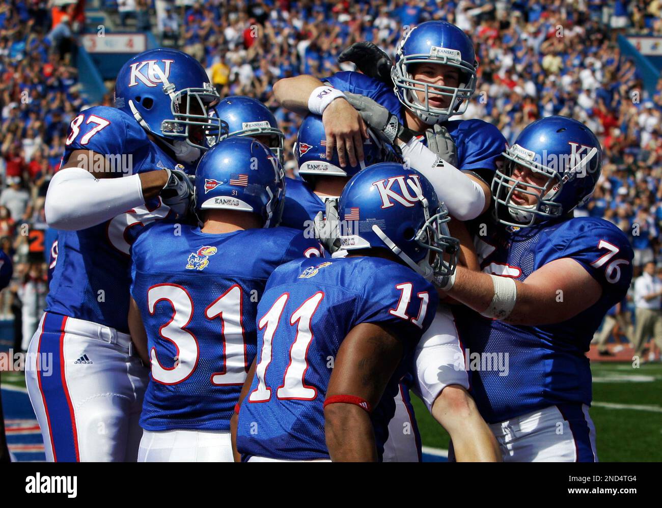 Kansas Jayhawks quarterback Jordan Webb, top, celebrates a touchdown ...