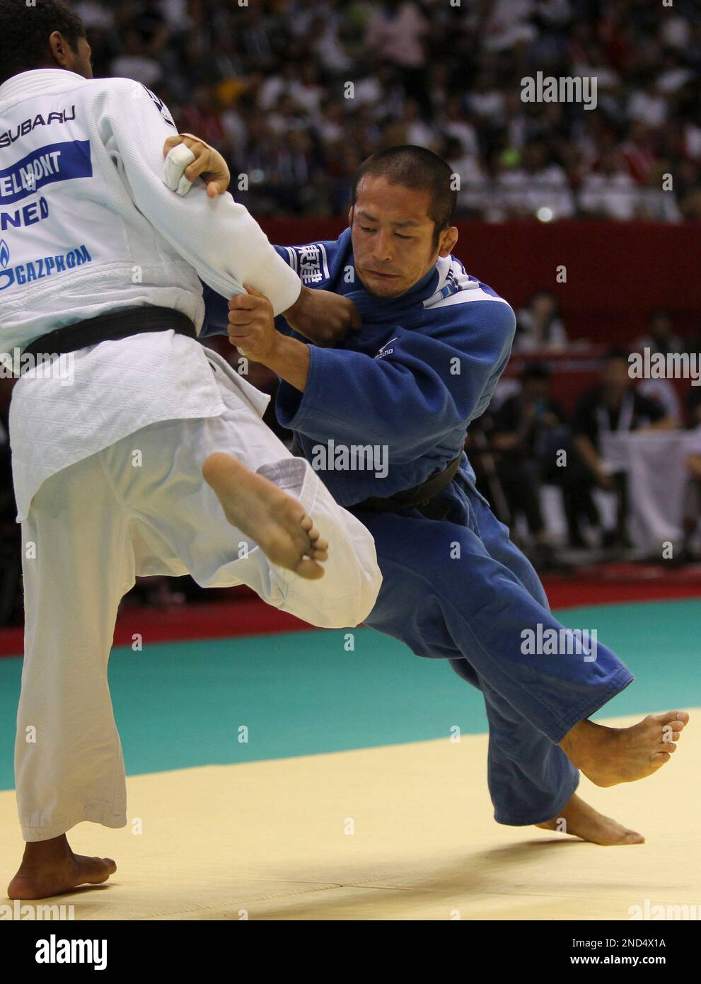 Japan's Hiroyuki Akimoto, right, battles with Dex Elmont of the ...