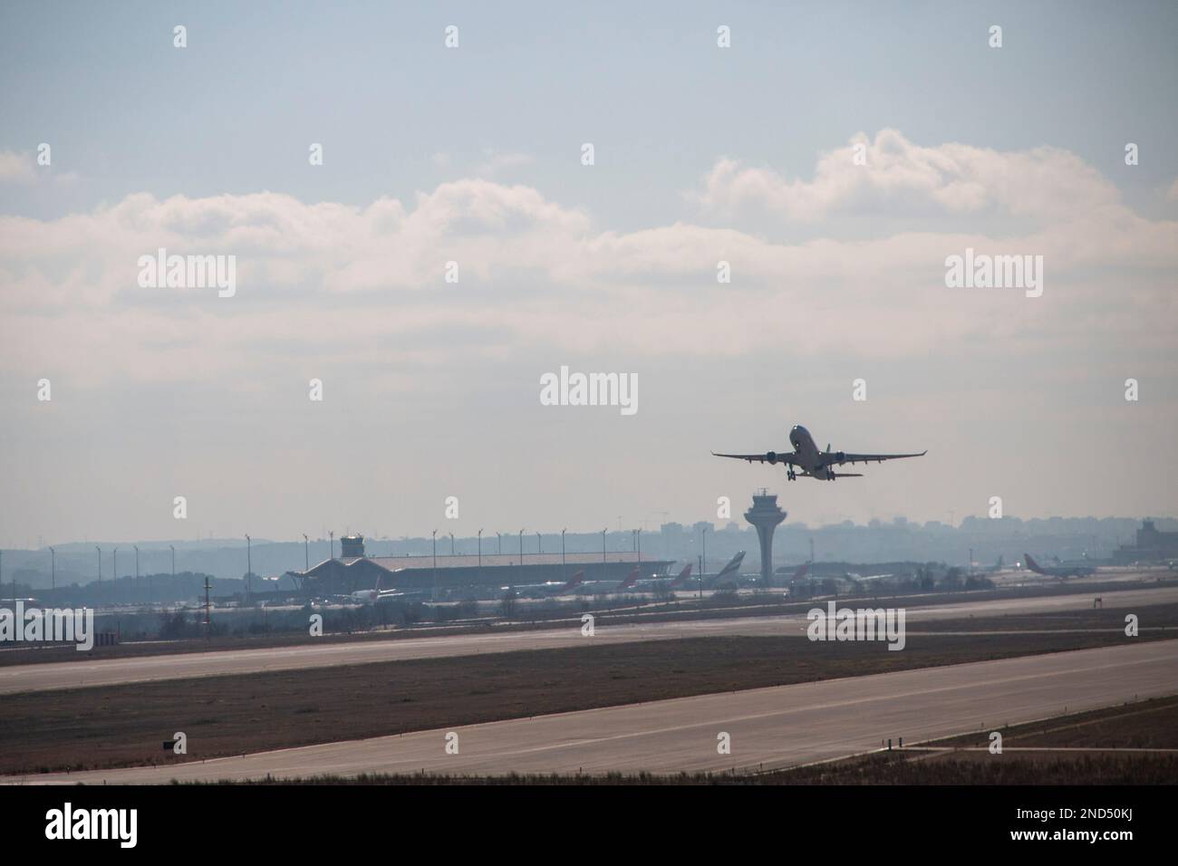 Plane ascending, taking off from the airport where you can see it along ...