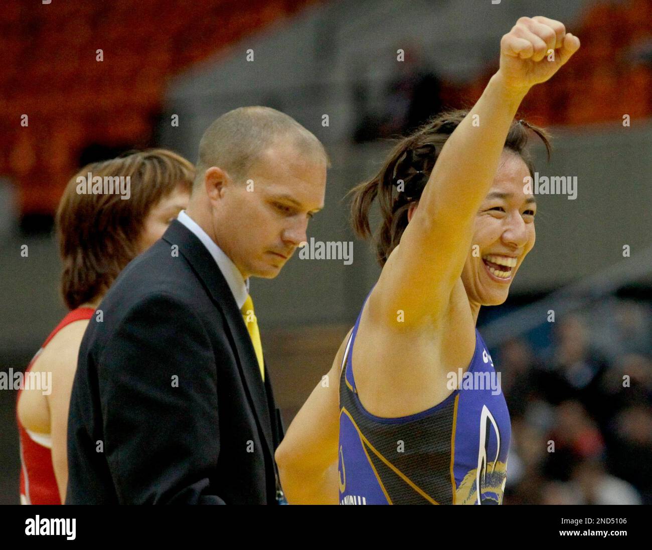 Japan's Hamaguchi Kyoko, in blue, reacts after defeating Spain's Maider ...