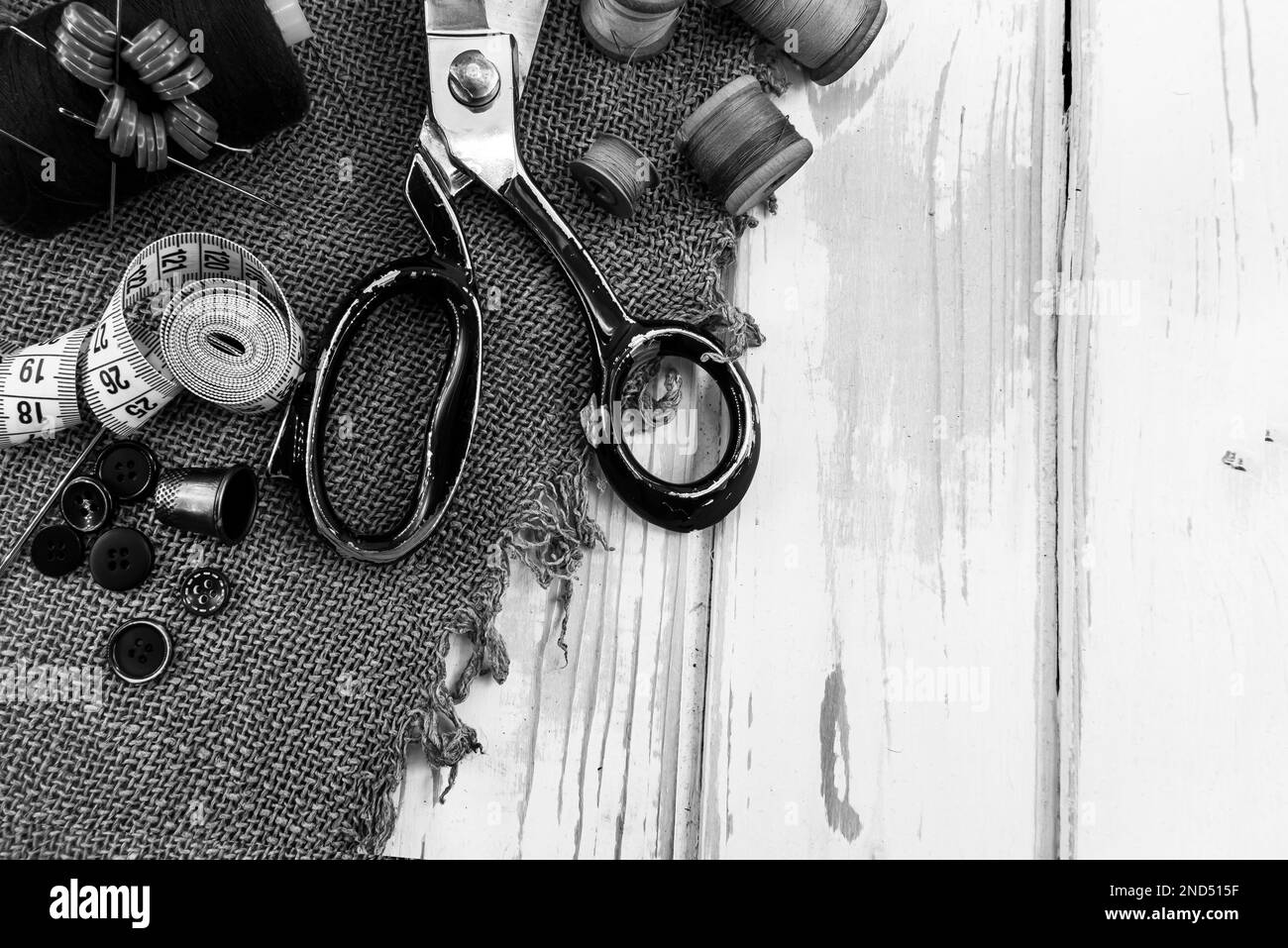 Retro tools for cutting and sewing. Needle with thread, thimble, sewing ...