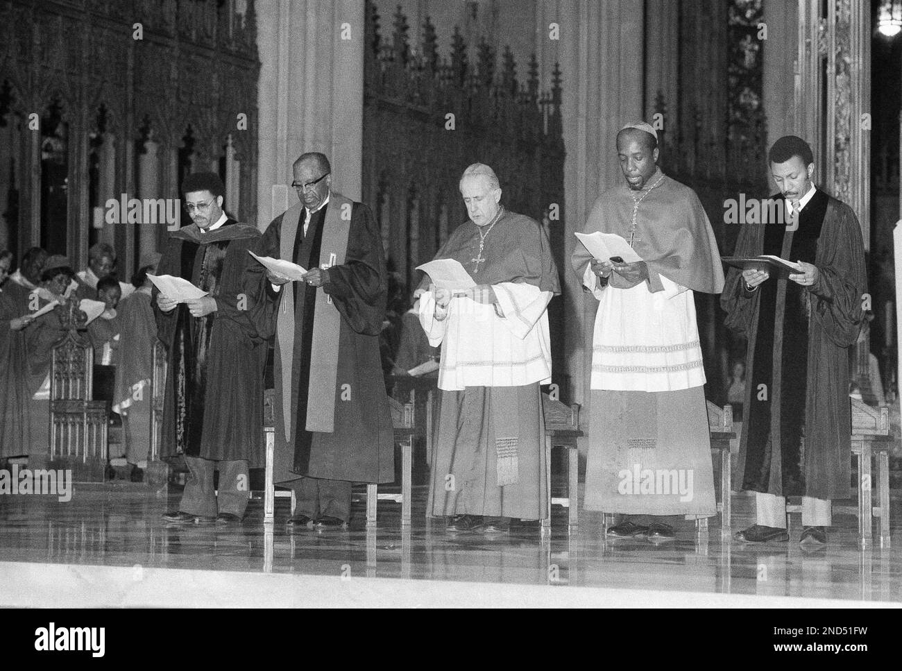 Catholic and Protestant clergymen, from left, the Rev. Simon Bouie, the ...