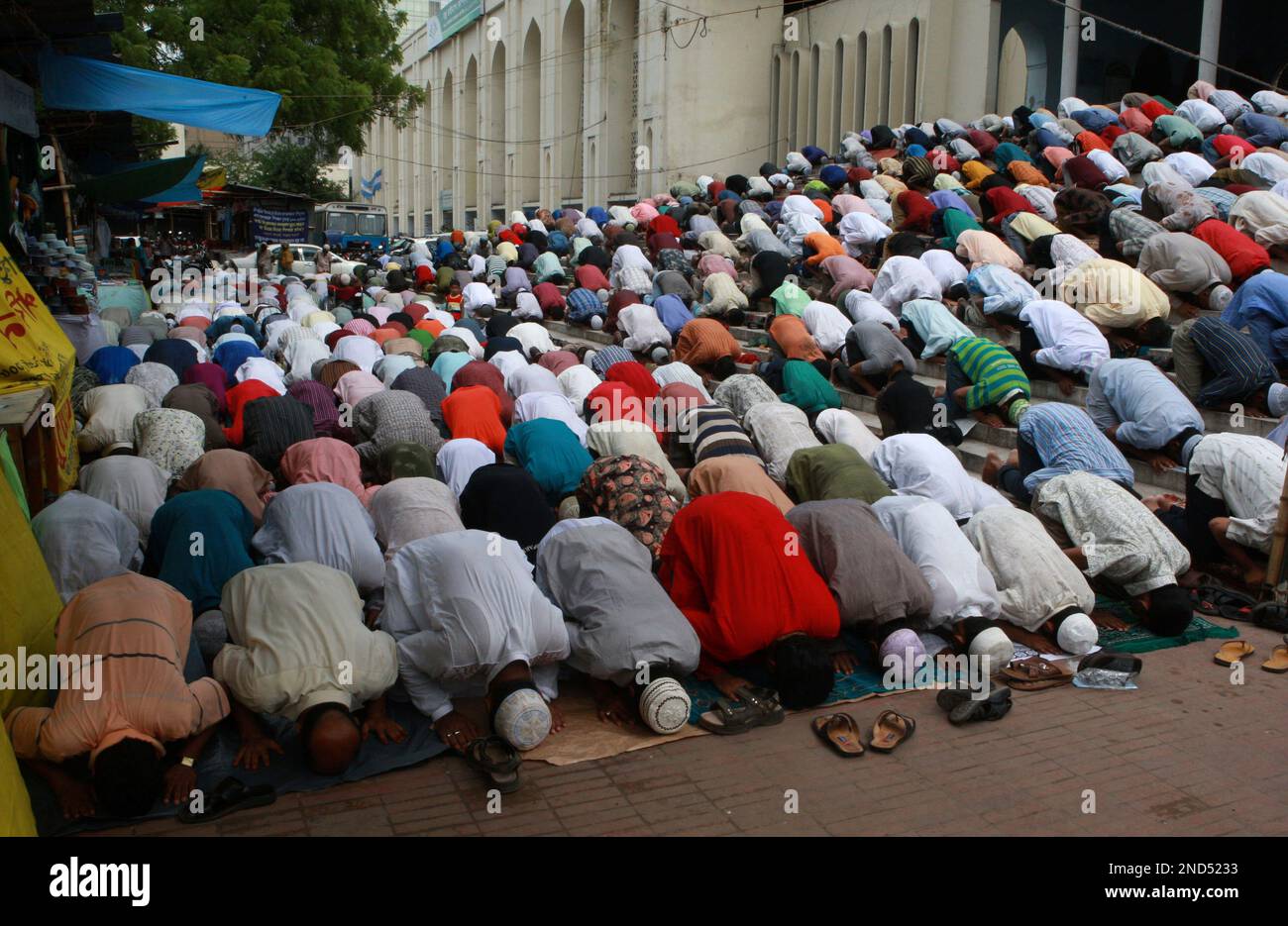 Bangladeshi Muslims offer prayers on the last Friday of Ramadan, a day ...