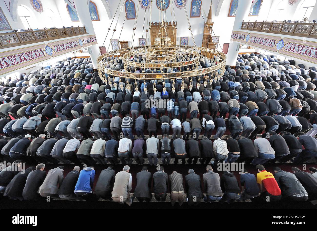 Muslims pray at a mosque for the Eid al-Fitr holiday, which marks the ...
