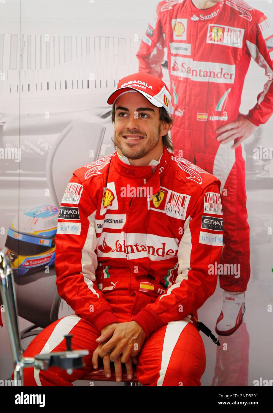 Ferrari driver Fernando Alonso of Spain smiles during the second free ...