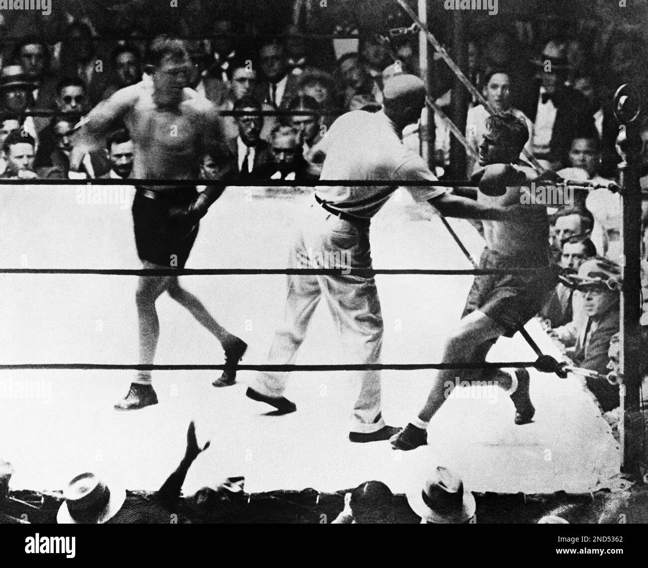British boxer Phil Scott, alias Philip Suffling is helped up during a ...