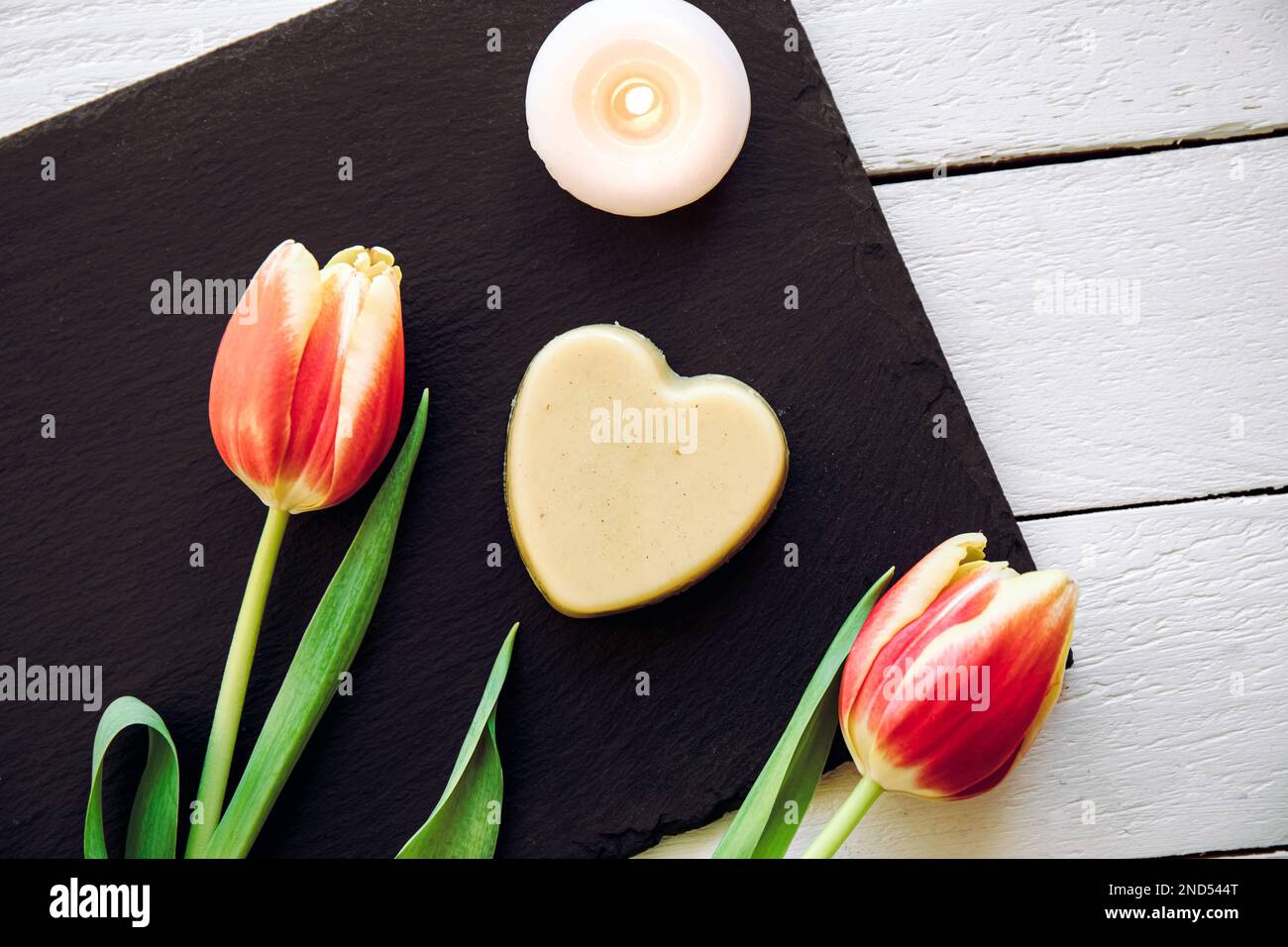 Homemade solid moisturizing hand cream. Heart shape cream bar made of ...