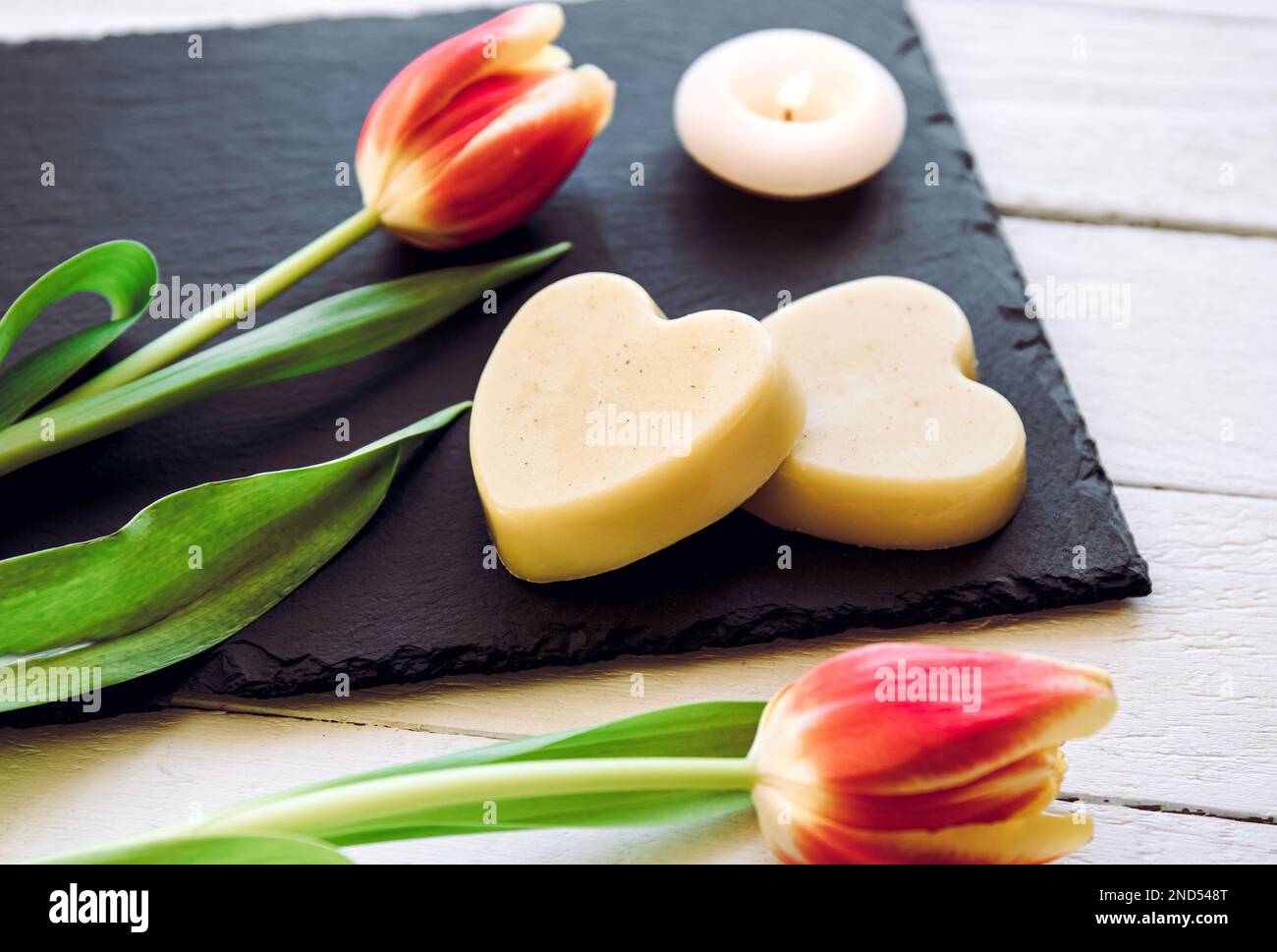 Homemade solid moisturizing hand cream. Heart shape cream bar made of ...