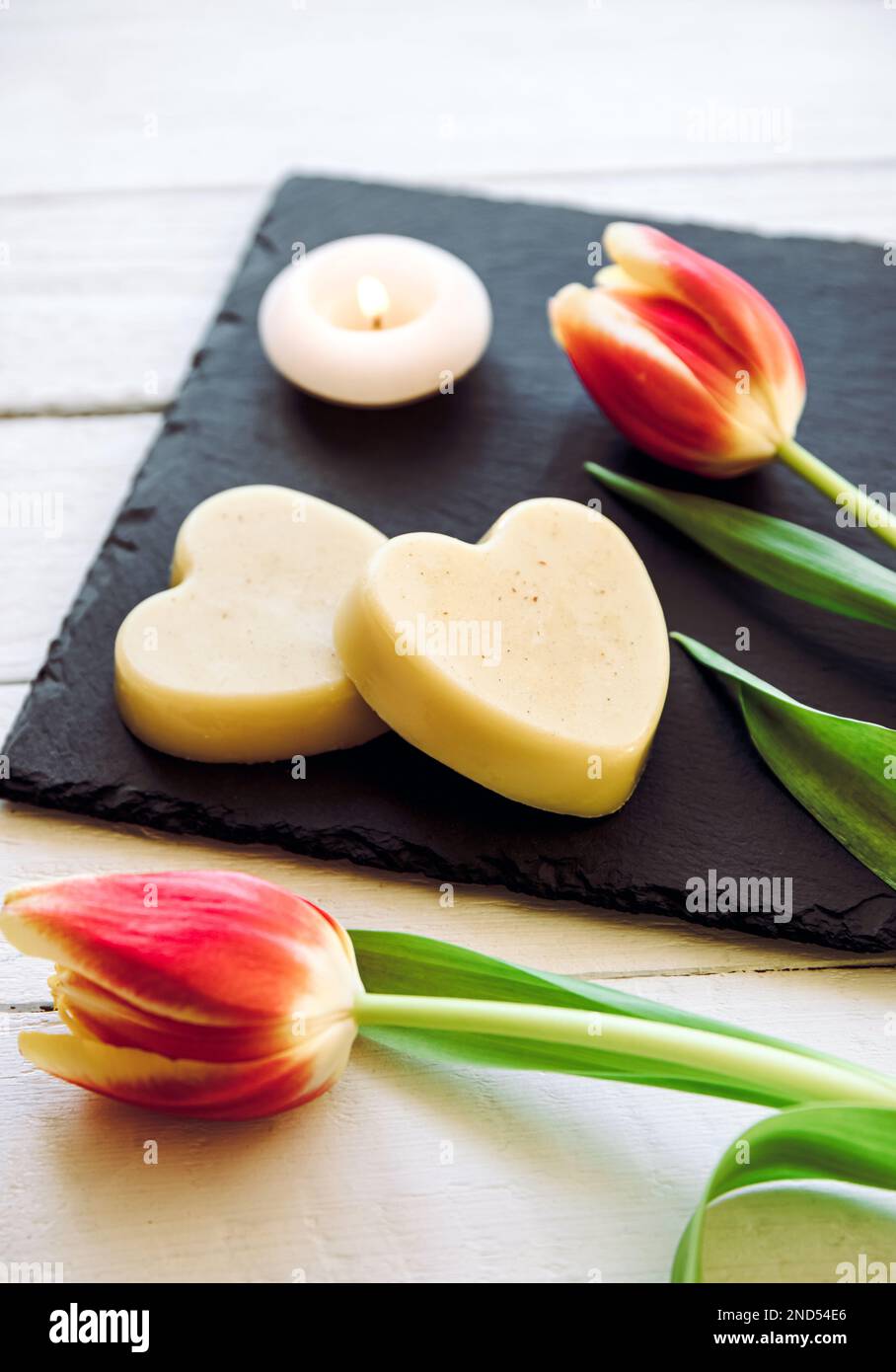Homemade solid moisturizing hand cream. Heart shape cream bar made of ...