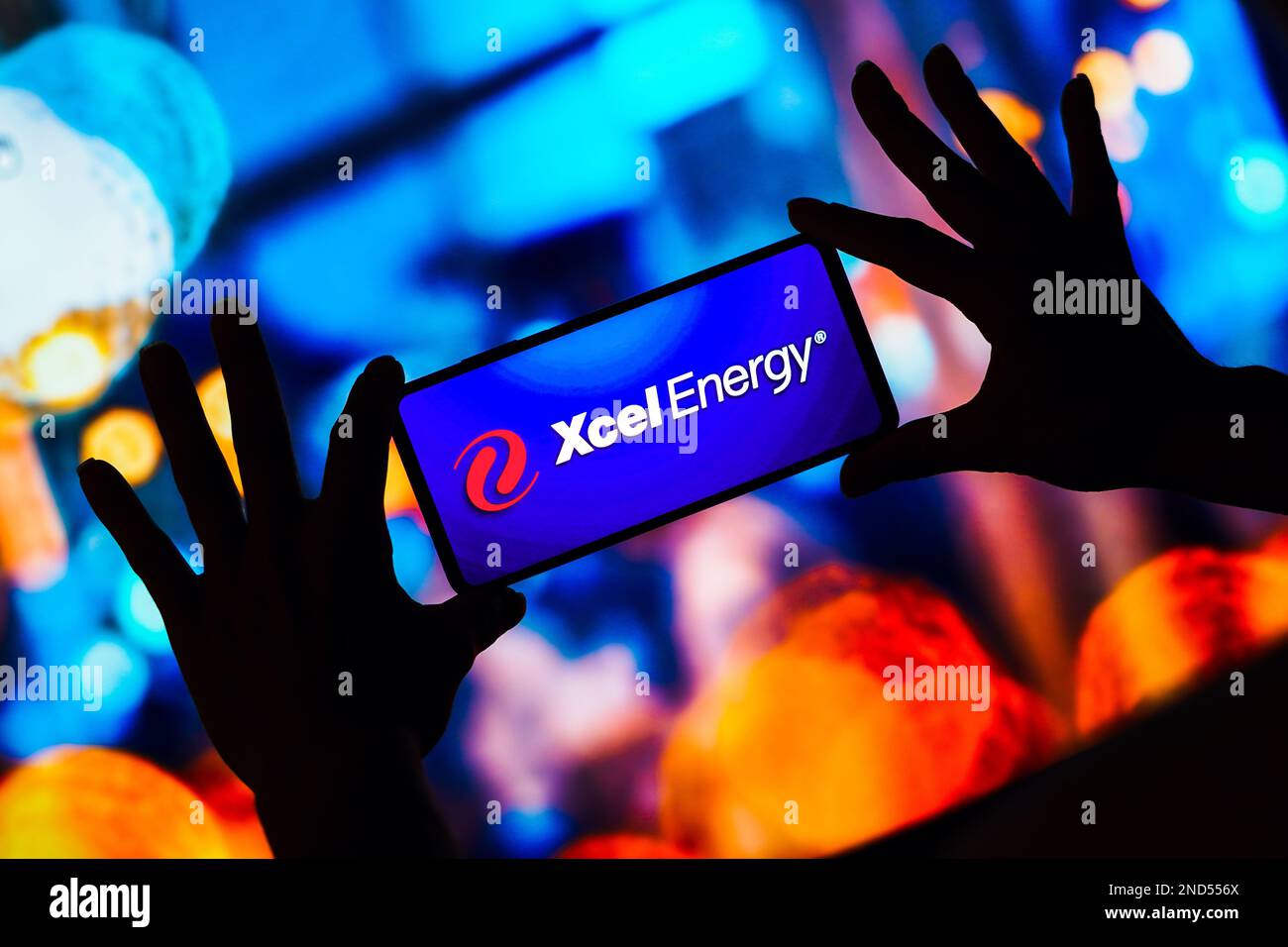 In this photo illustration, the Xcel Energy logo is seen displayed on a ...