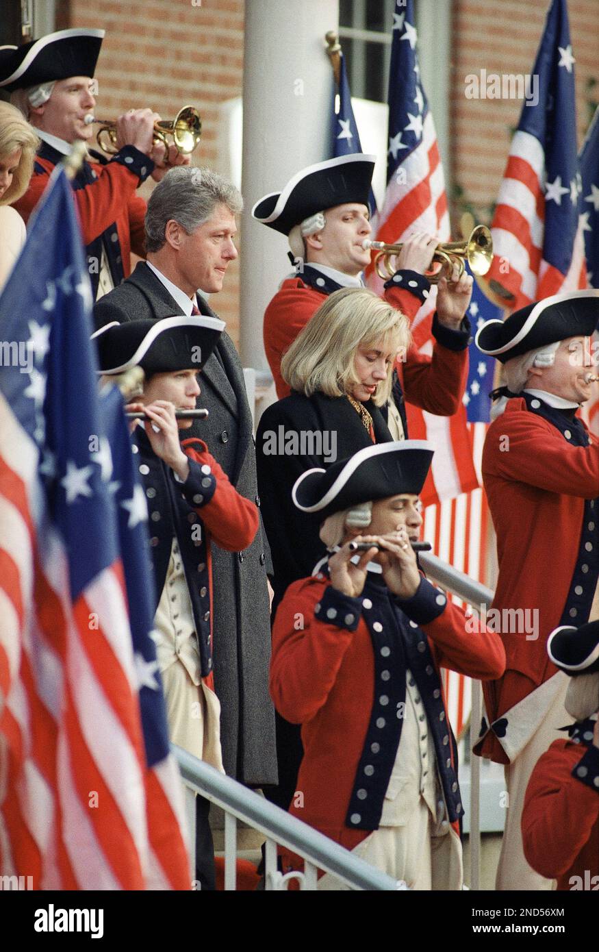 As a band in Colonial garb plays, President-elect Bill Clinton and his ...
