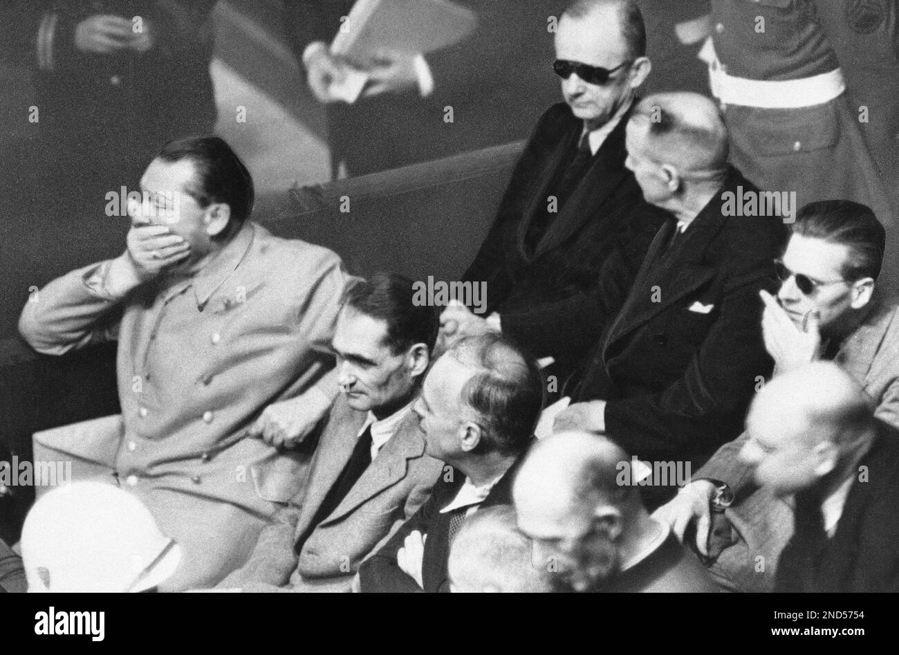 Hermann Goering (at left in top of photo) claps his hands over his ...