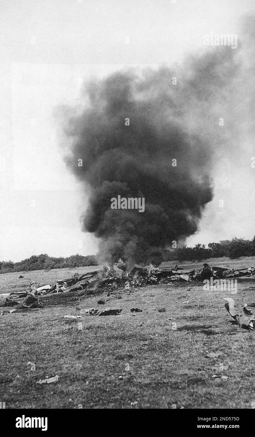 A cloud of black smoke rises from a blazing Nazi fighter which crashed ...