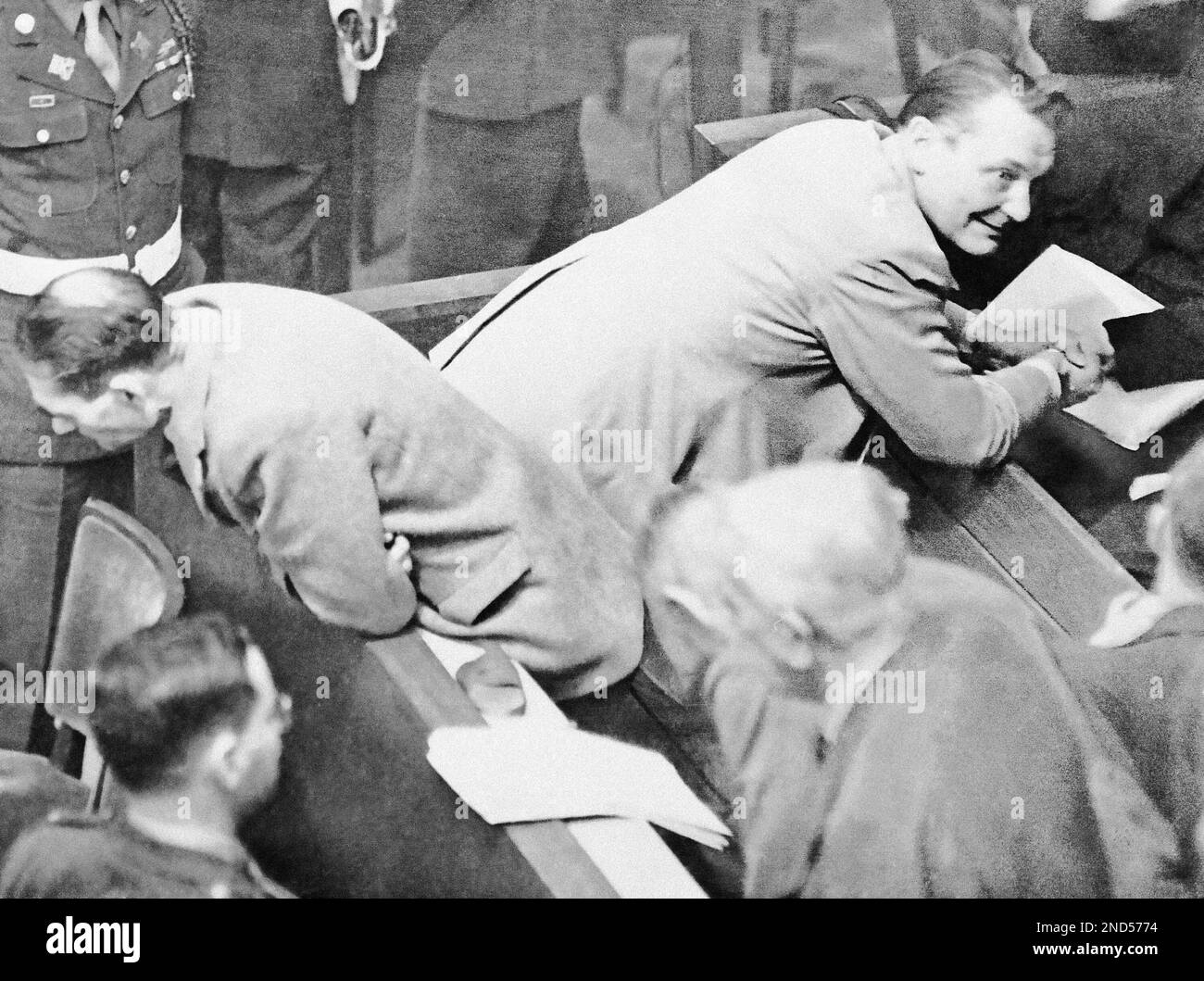 Hermann Goering faces back to talk with fellow defendants in the second ...