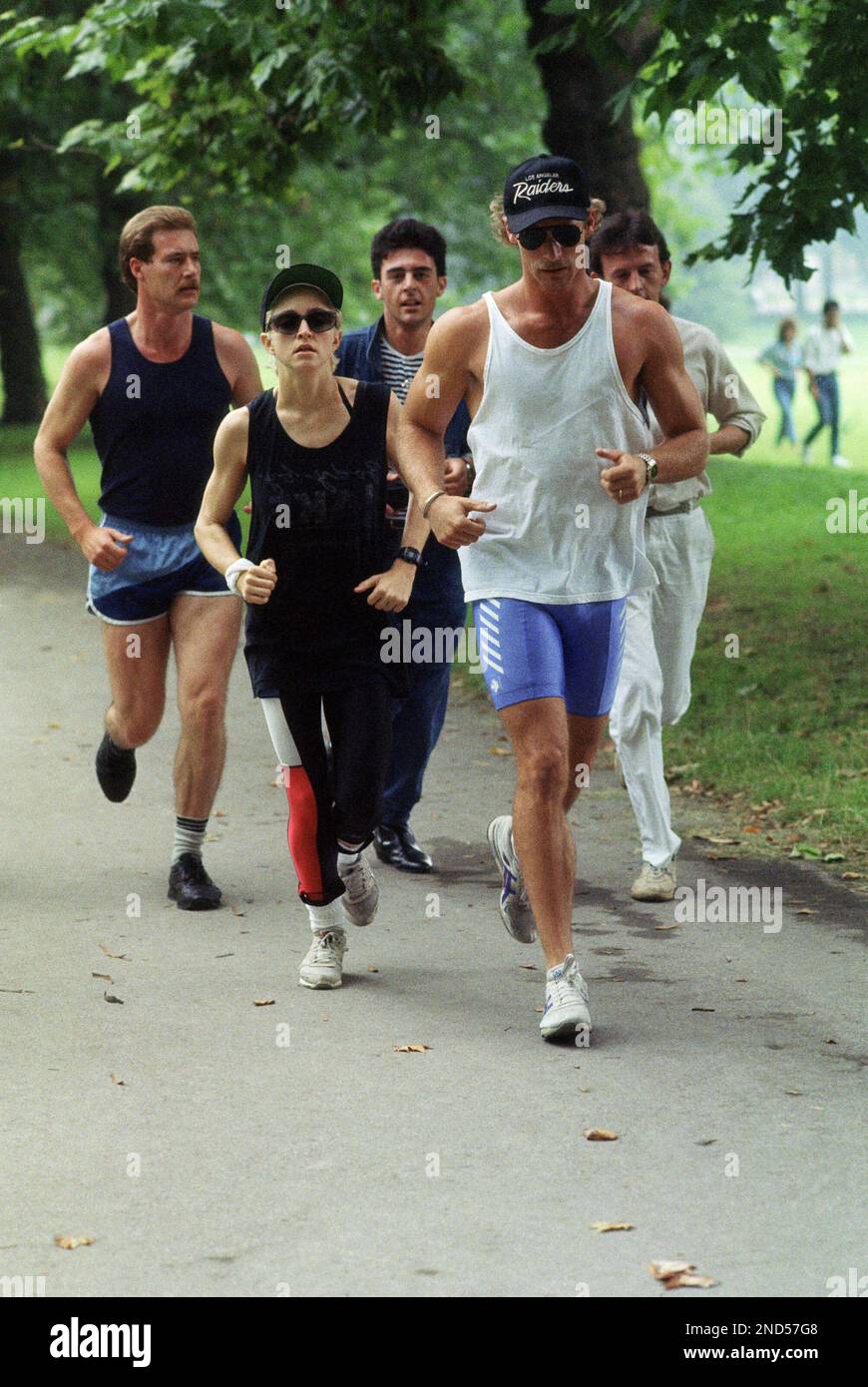 Pop superstar Madonna jogs again in London's Green Park, Aug. 18, 1987 under the watchful eyes ...