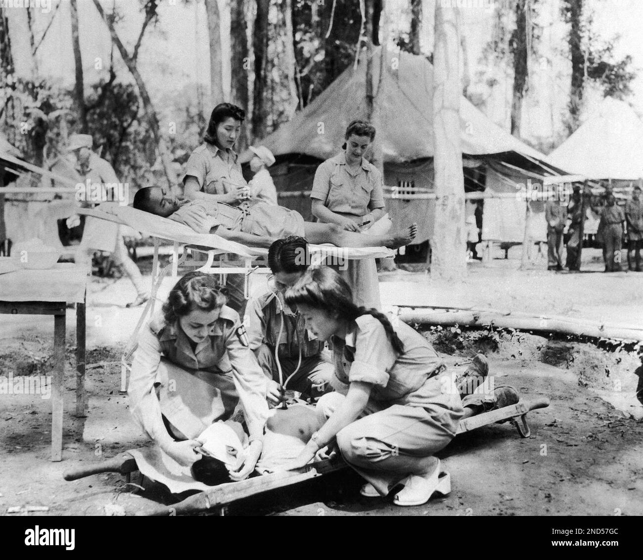 Nurse Nancy Cooke (foreground, left) and Marie M. Carroll (background ...