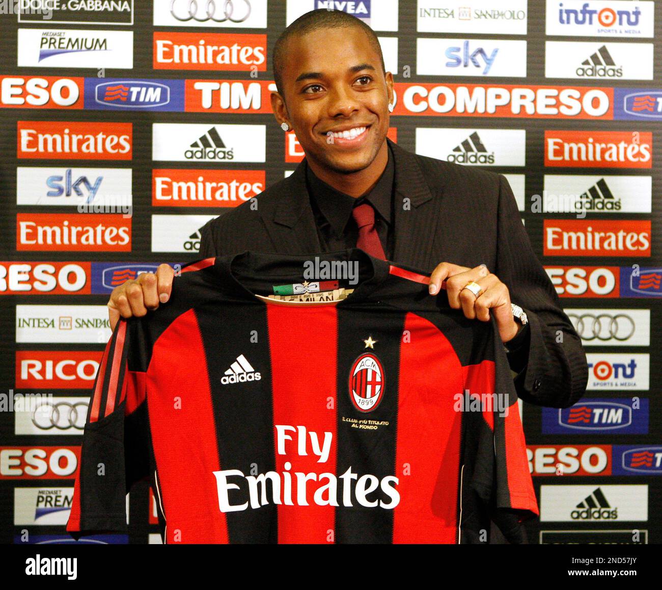 AC Milan newly signed Brazilian soccer forward Robinho shows a team ...