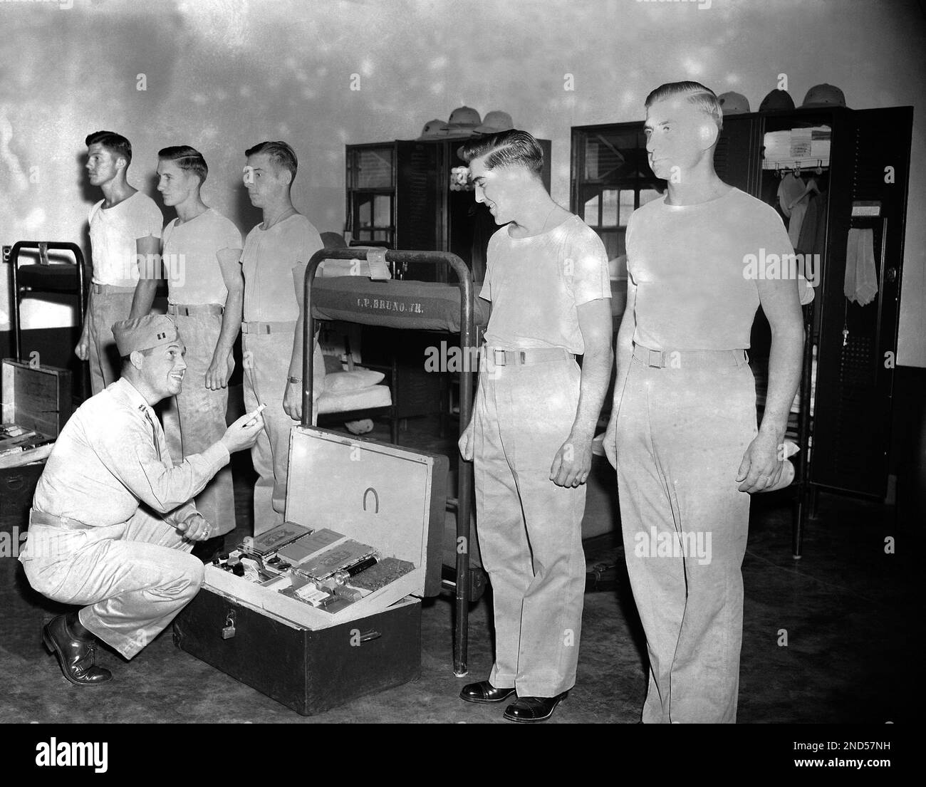 Capt. Paul A. Rebola of Philadelphia, Pa., inspects a foot-locker in ...