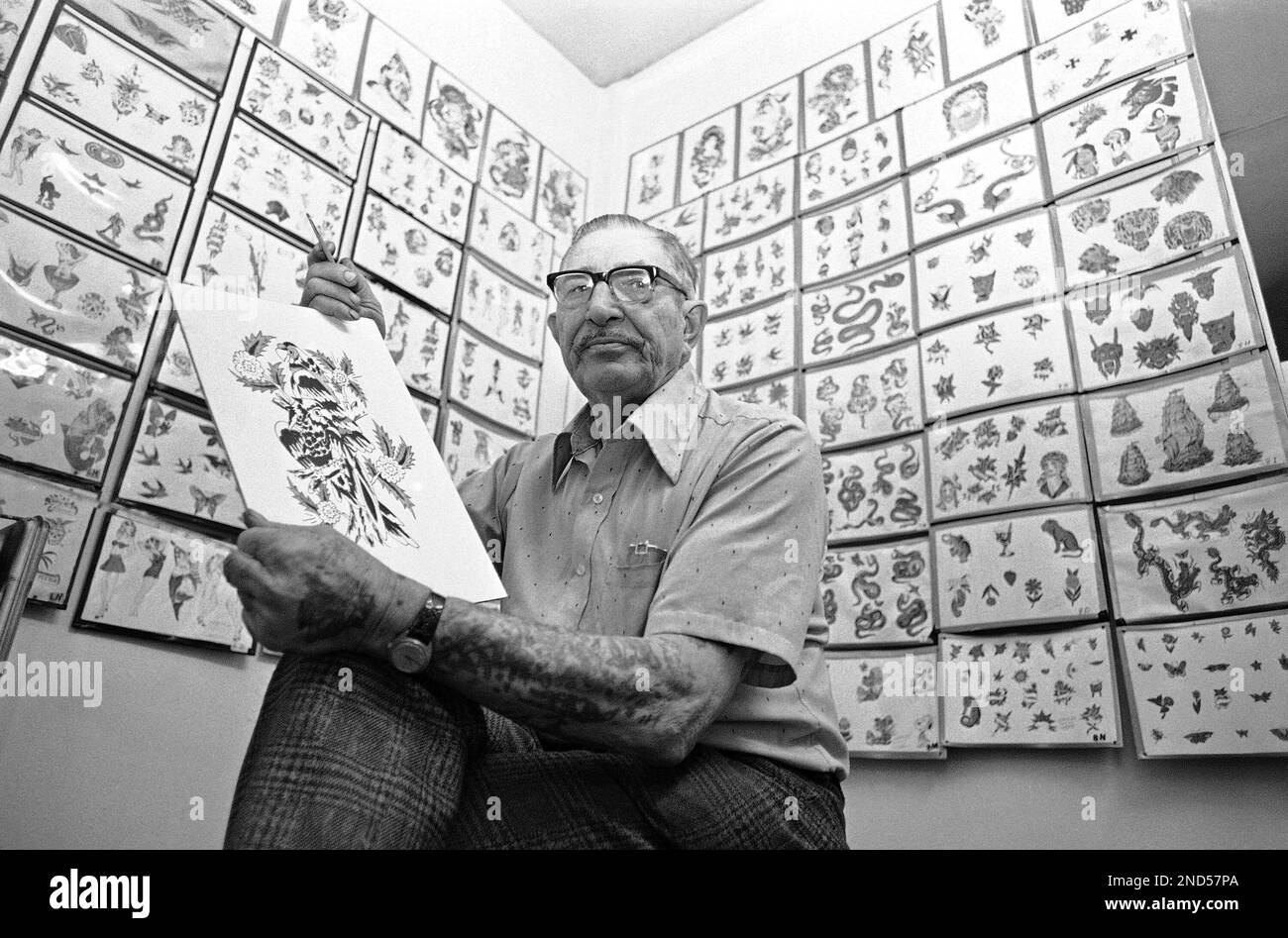 Charles J. Geizer, better known as Tattoo Charlie, shows a drawing of ...