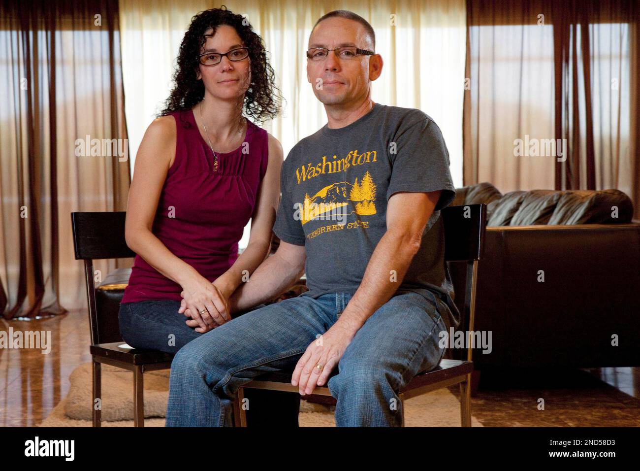 Emma and Christopher Winfield hold a photograph of their son, 22-year ...