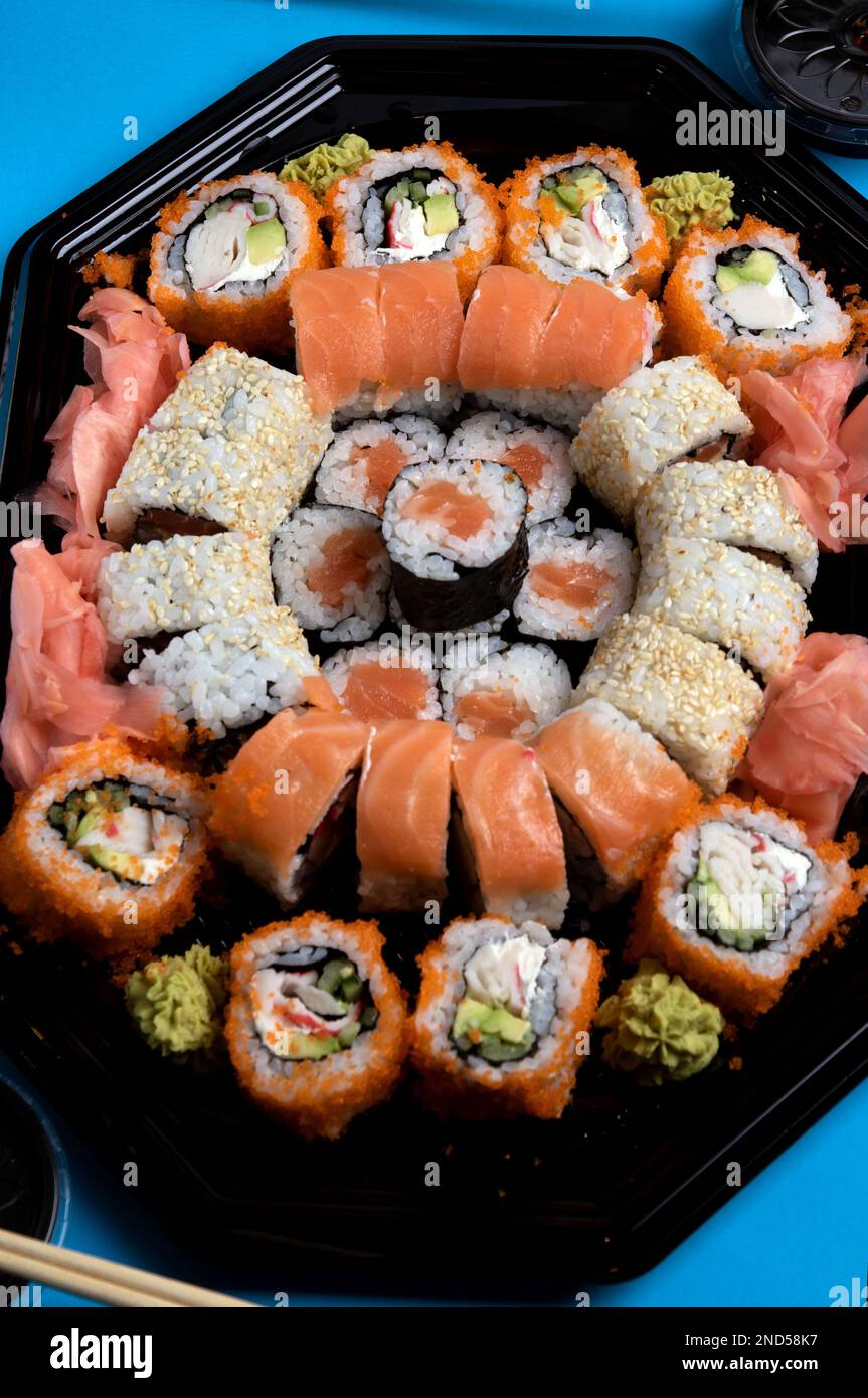 photos of many different kinds of sushi lying around Stock Photo - Alamy