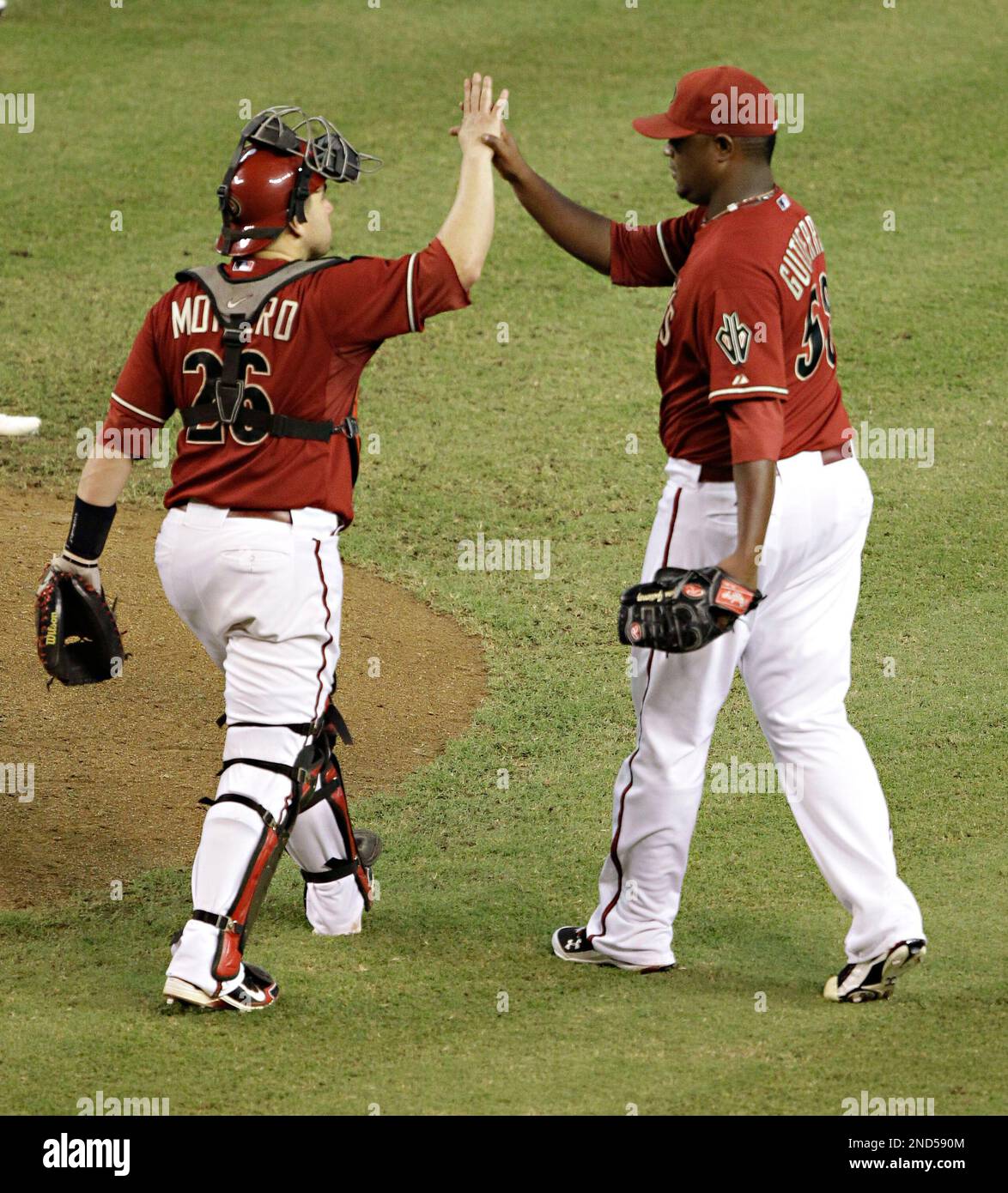Arizona Diamondbacks relief pitcher Juan Gutierrez (58) high-fives ...