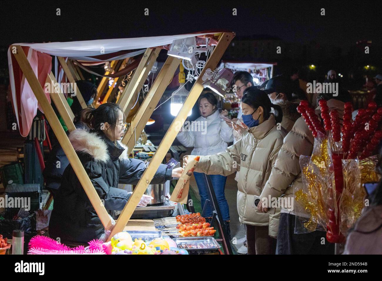 Ningbo, China's Zhejiang Province. 15th Feb, 2023. People buy snacks at ...