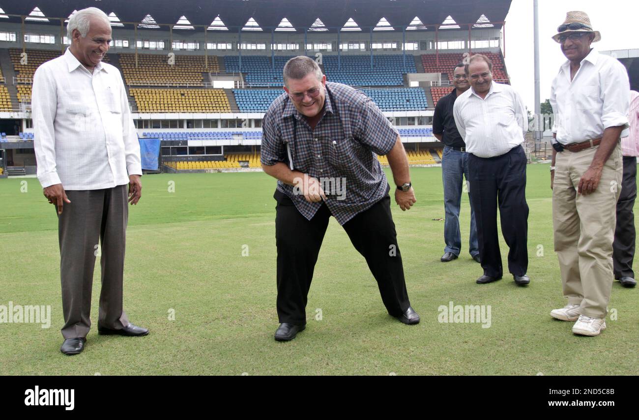 International Cricket Council (ICC) pitch curator Andy Atkinson, center ...