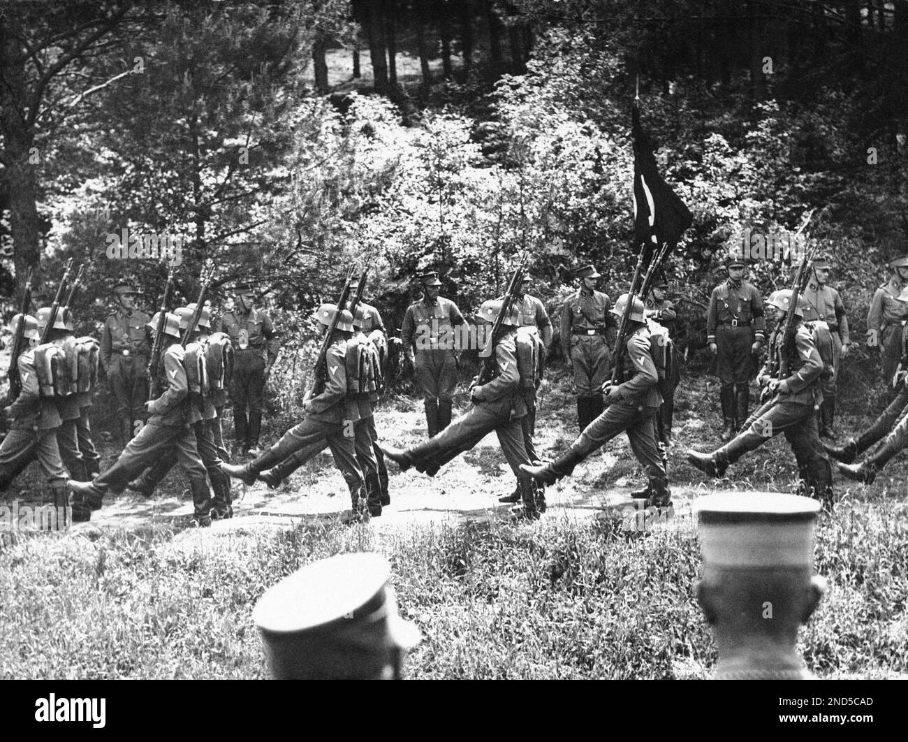 An honor detachment of the army goose-stepping during the parade before ...