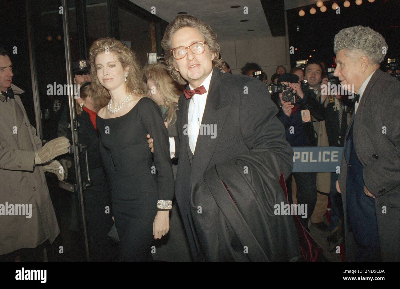 Actor Michael Douglas, right, escorts his wife, Diandra, into the Loew ...