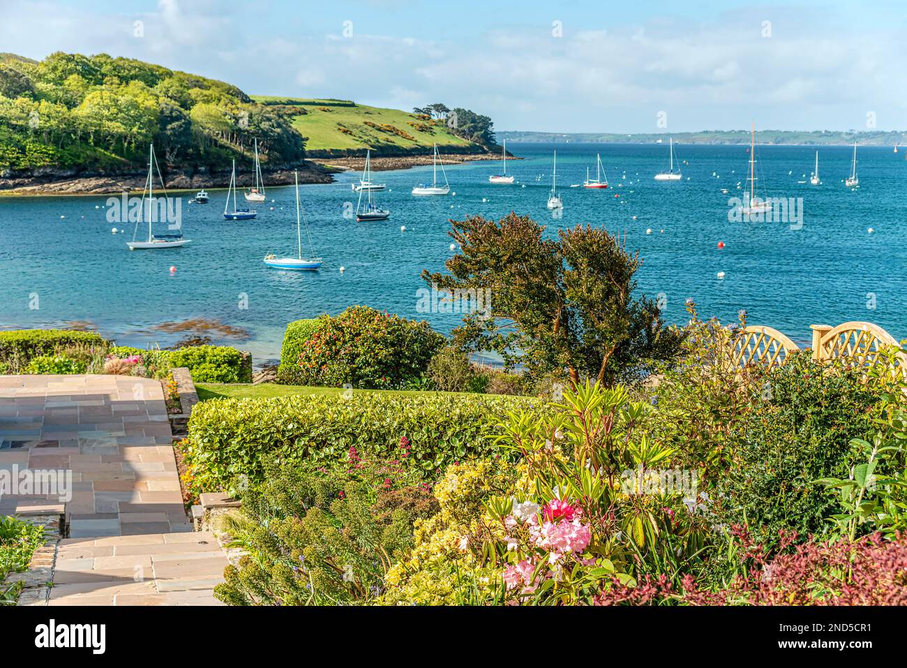View from a garden across the scenic coastline near the fishing village ...