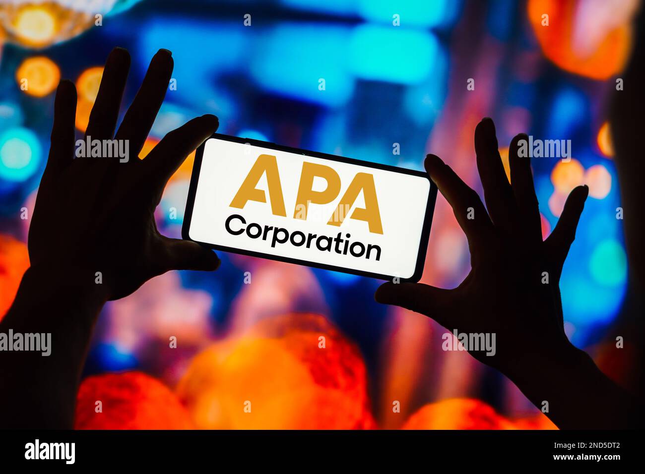 In this photo illustration, the APA Corporation logo is seen displayed ...