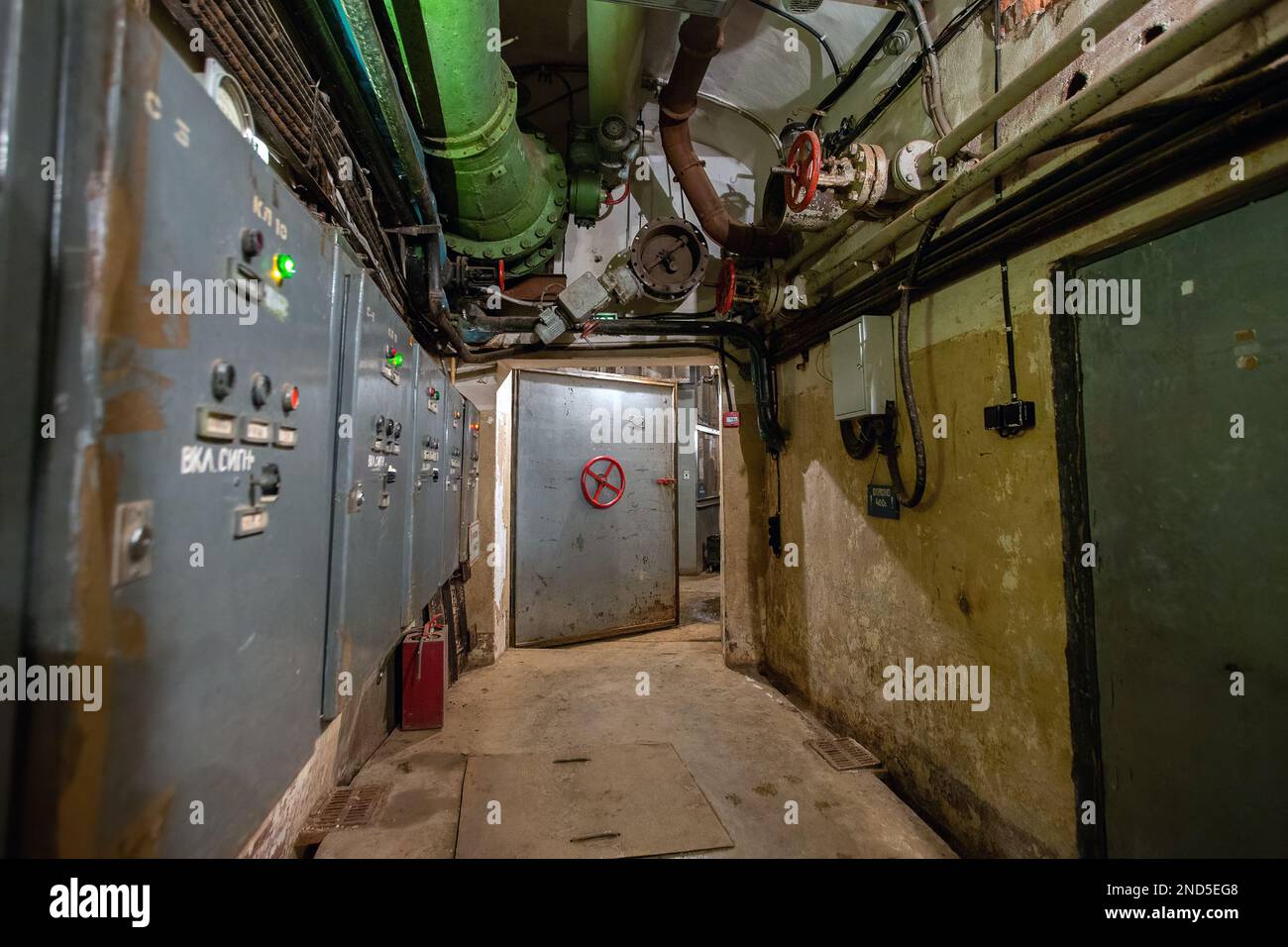 Hermetic rusty door of the bunker in underground abandoned tunnel ...