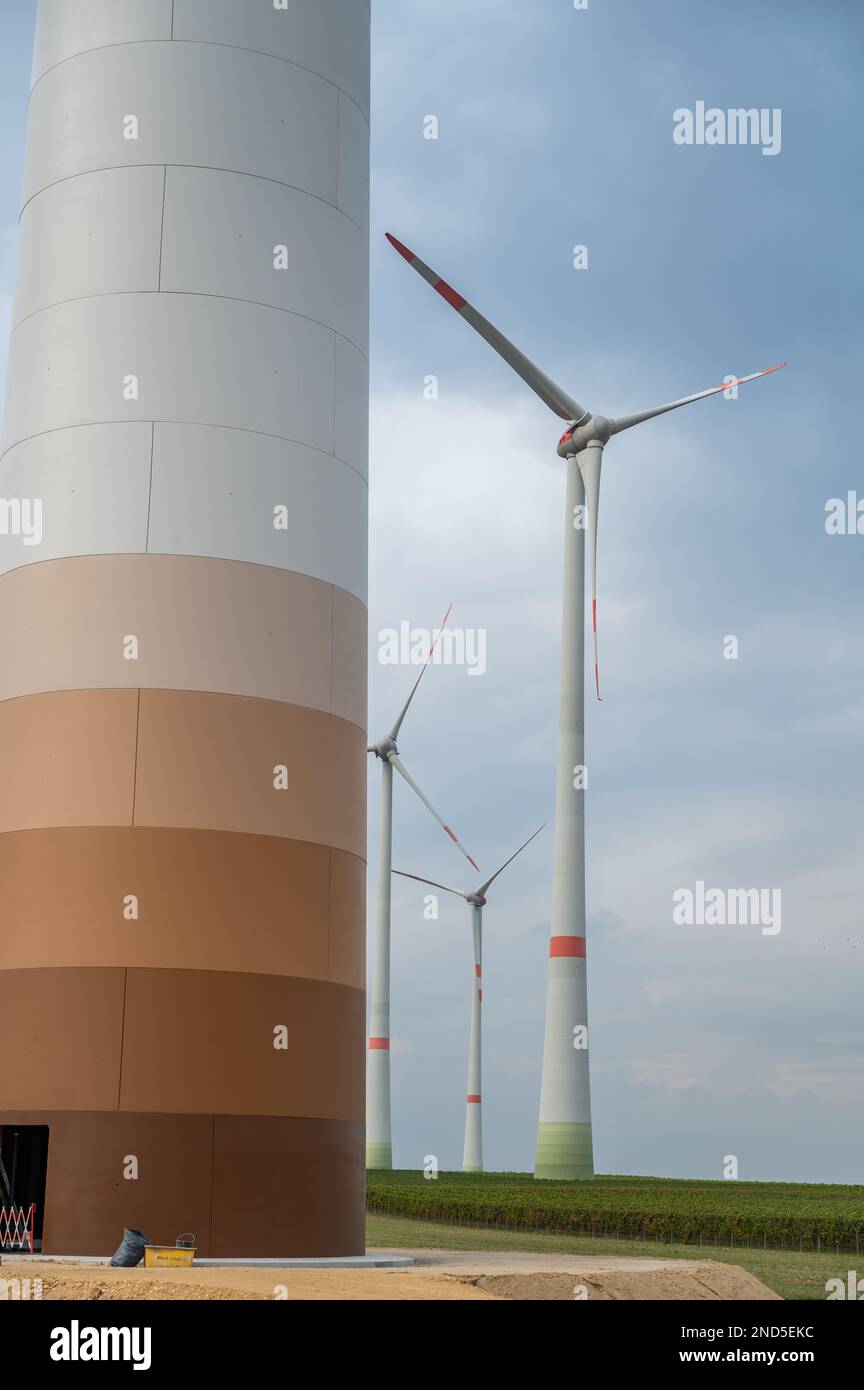 Wind turbine construction site at wind park with completed wind ...