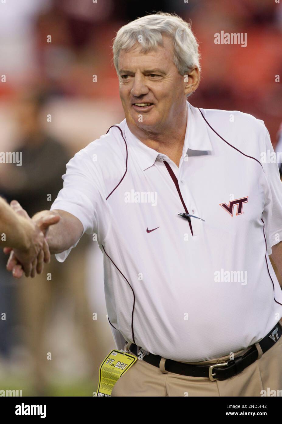 Virginia Tech coach Frank Beamer greets officials on the field during ...