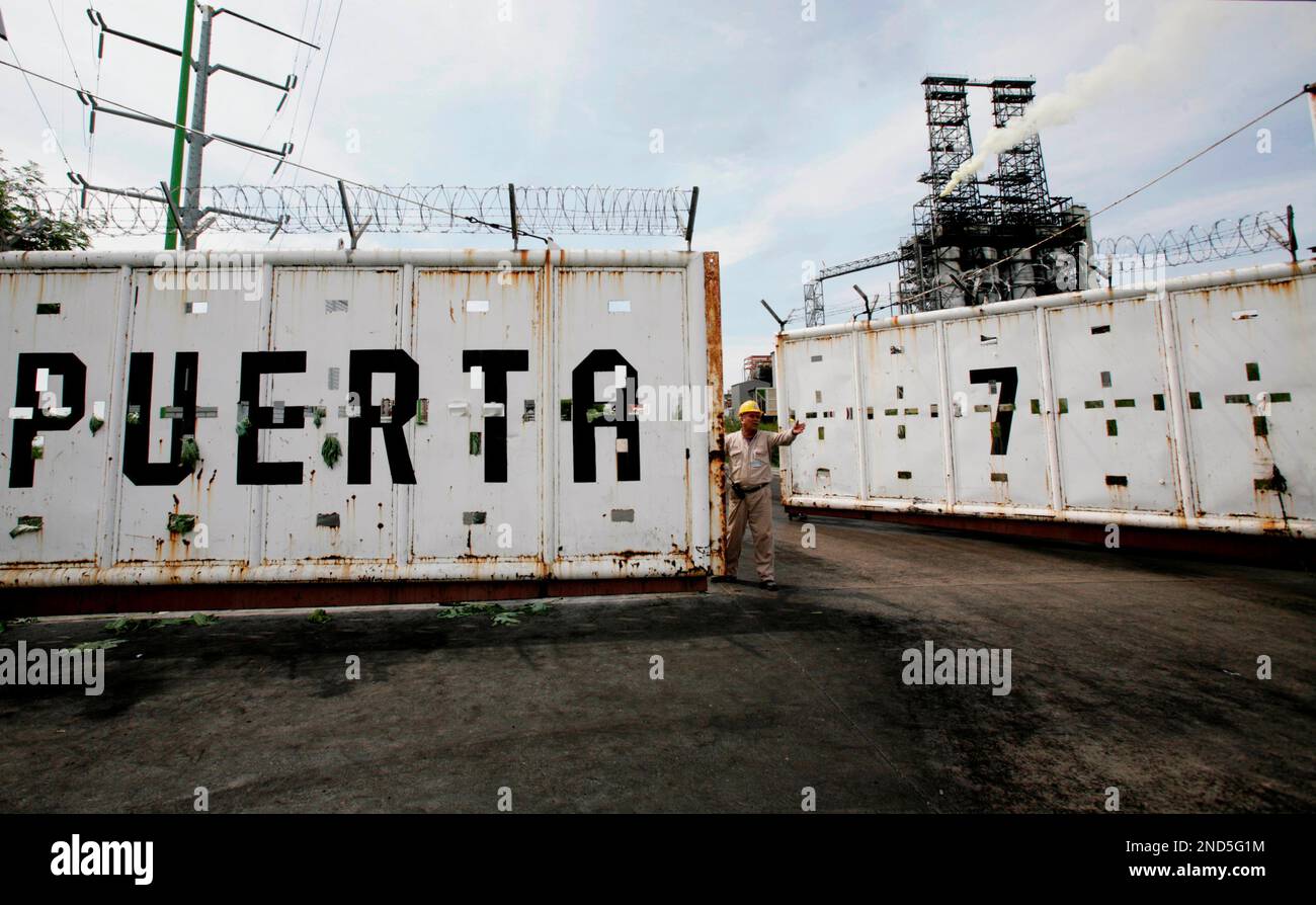 A worker gestures at the gate 7 of the Cadereyta refinery, owned by ...