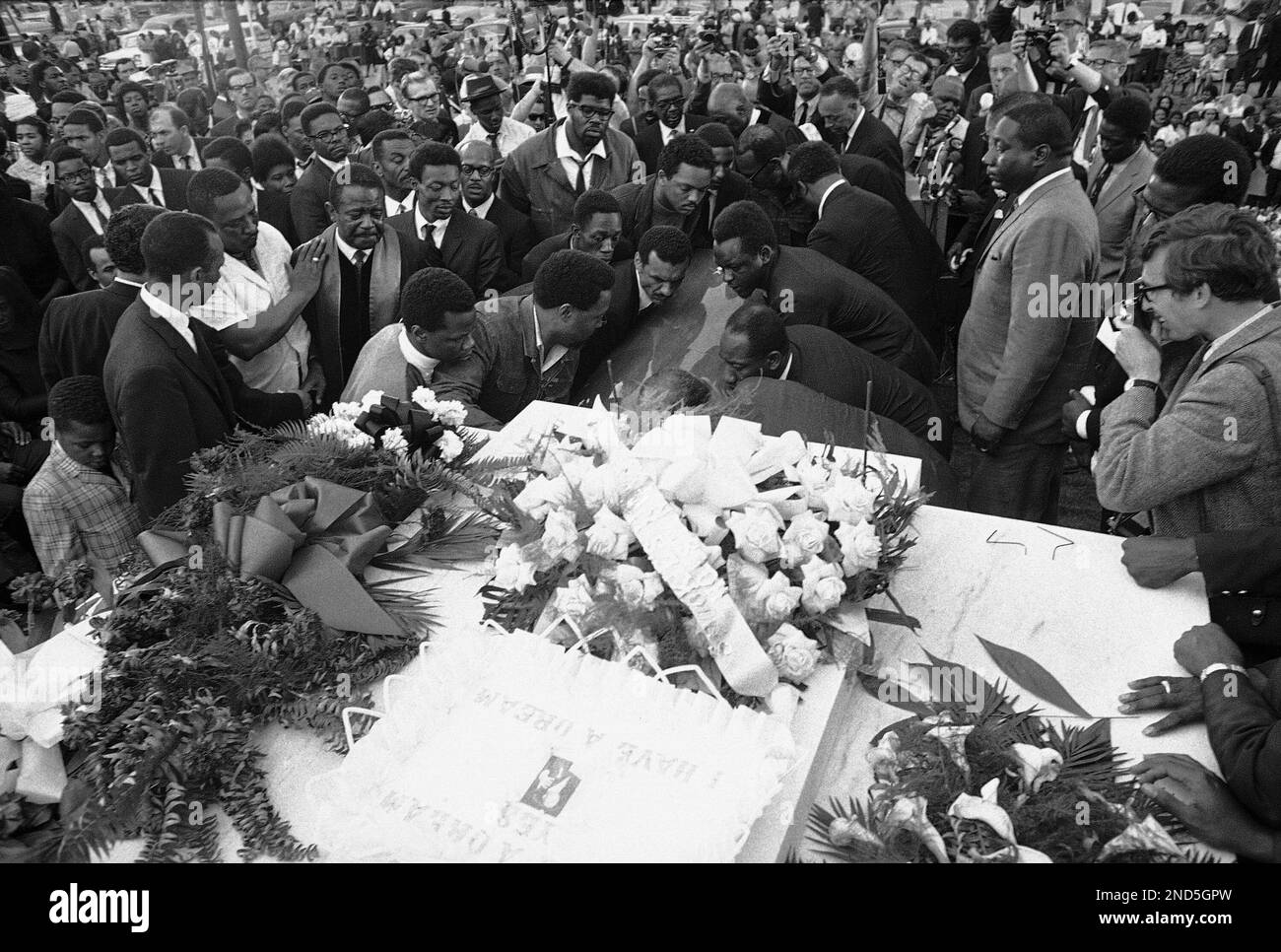 The mahogany casket bearing the body of Dr. Martin Luther King Jr., is ...