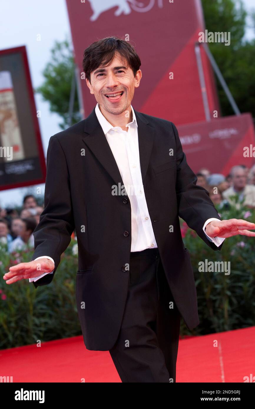 Actor Luigi Lo Cascio gestures as he arrives for the screening of the ...