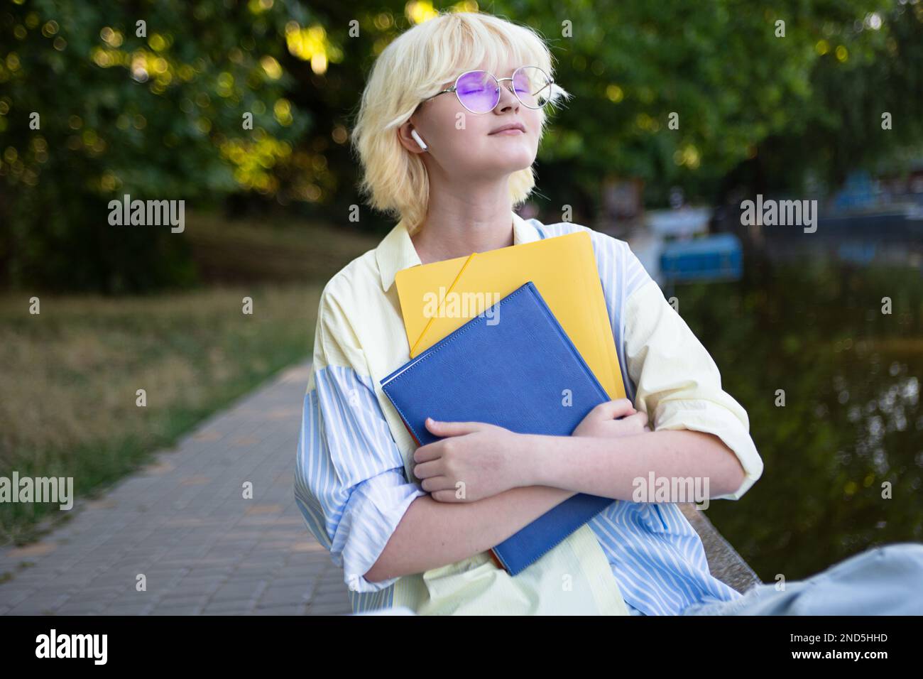 Photography with teenage girl with books and students folders Stock ...