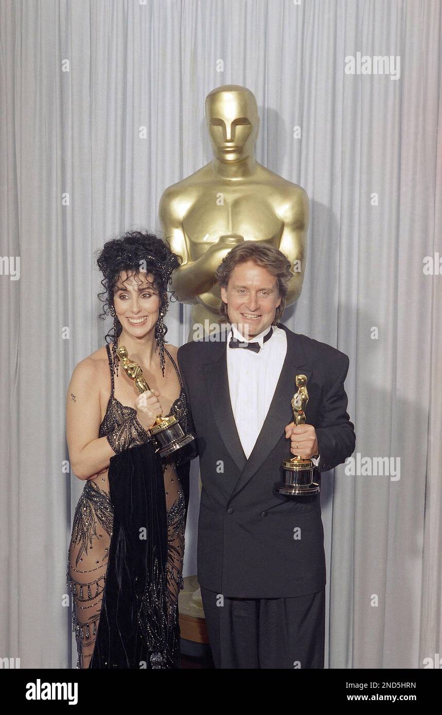 Michael Douglas poses with Cher at the Academy Awards in Los Angeles ...