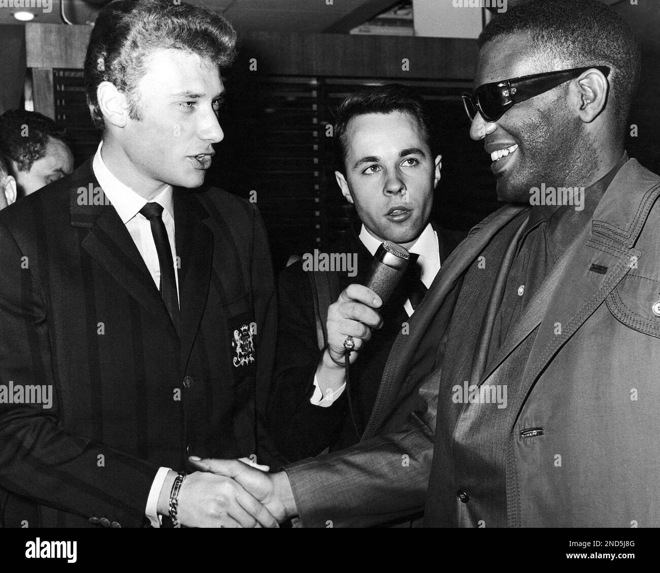 US musician Ray Charles, right, shakes hands with French musician ...