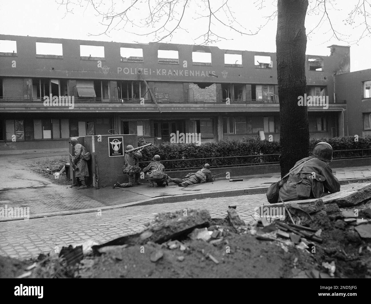 American troops of the U.S. Seventh Army one of whom carries a bazooka ...