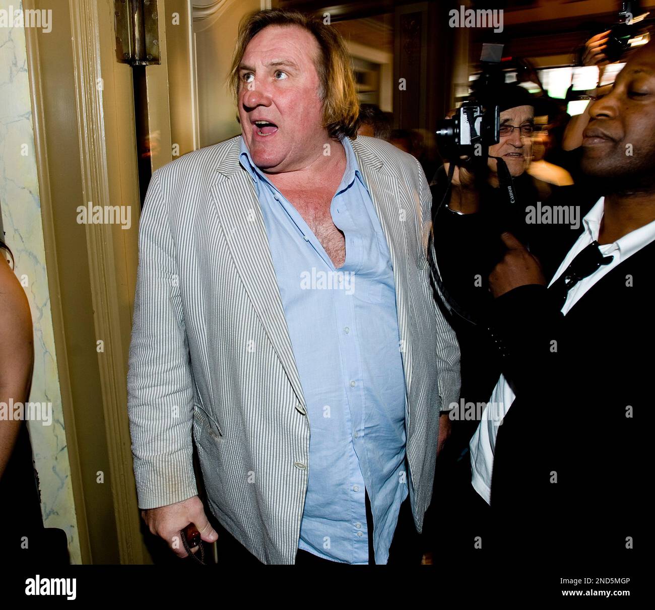 French actor Gerard Depardieu, left, arrives at the final day of the ...