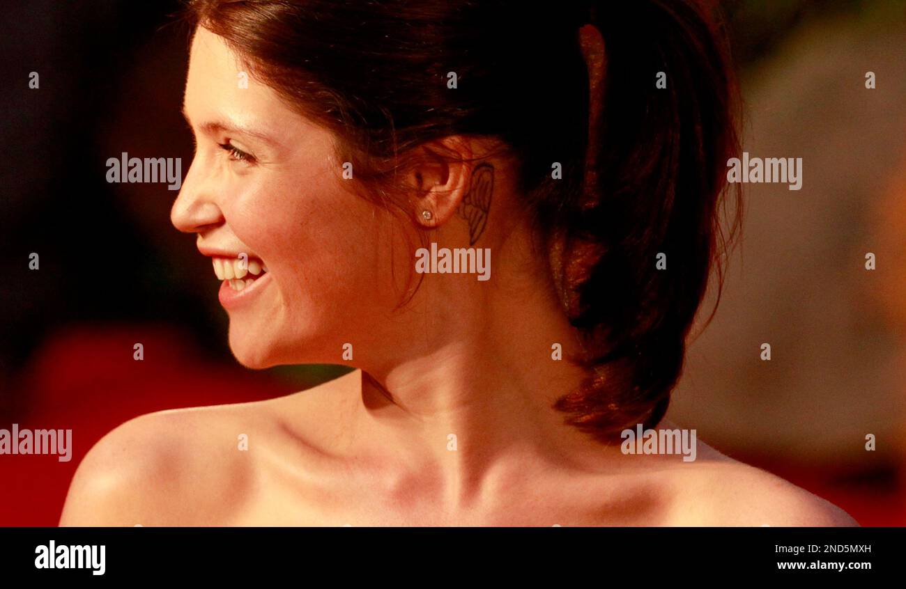 British actress Gemma Arterton reveals a tattoo of an angel wing behind ...