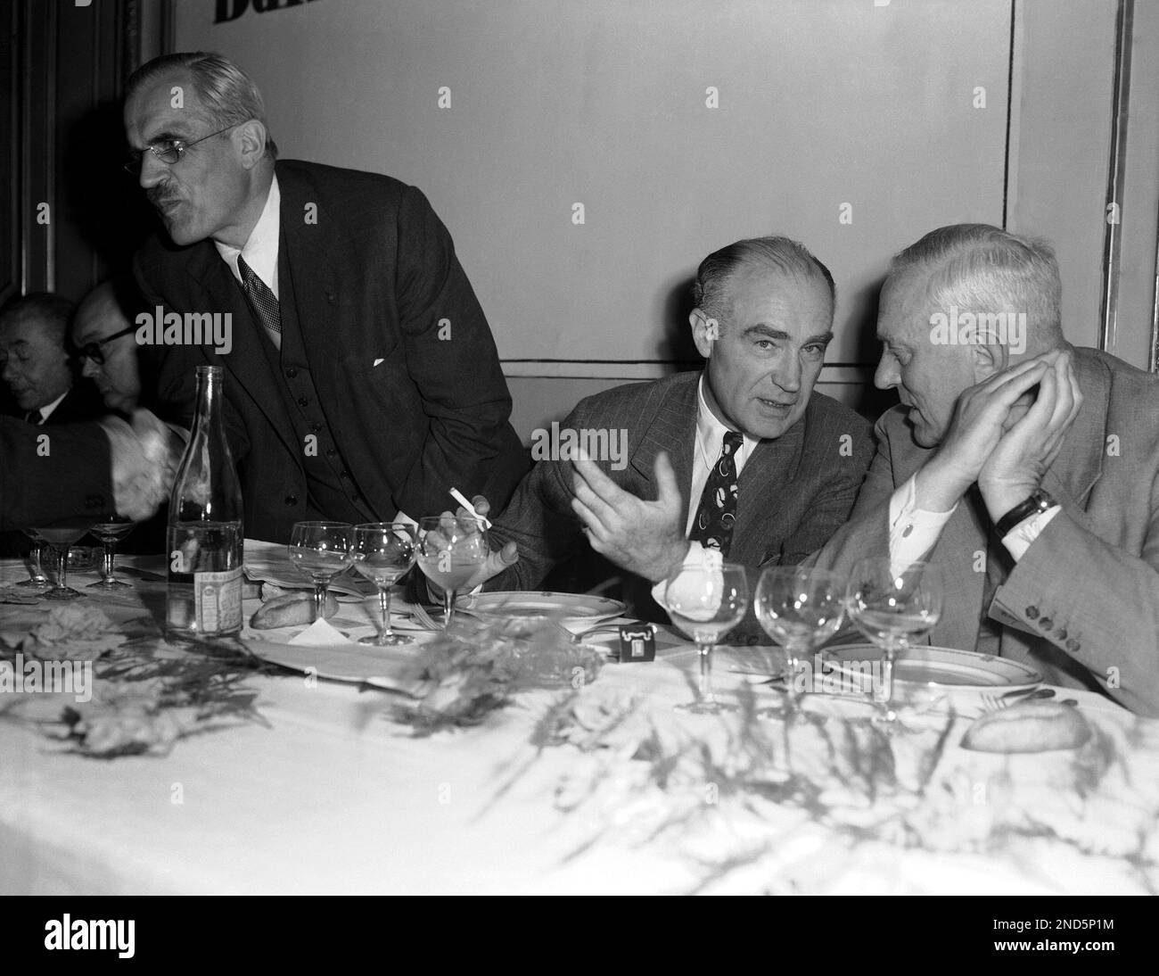 American publisher Henry Luce, center, gestures while speaking to an ...
