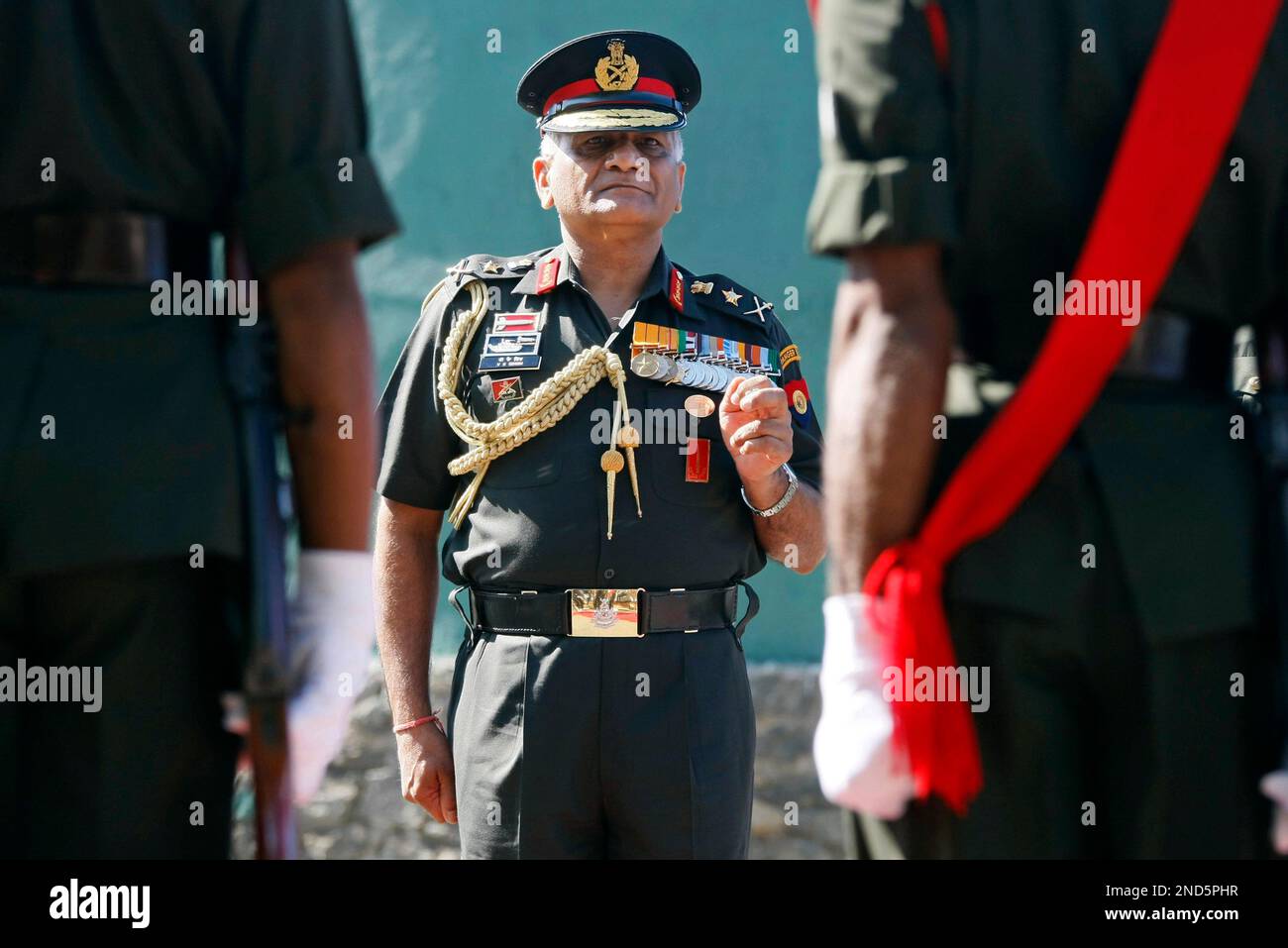 Indian army chief Gen. Vijay Kumar Singh, center, inspects a guard of ...