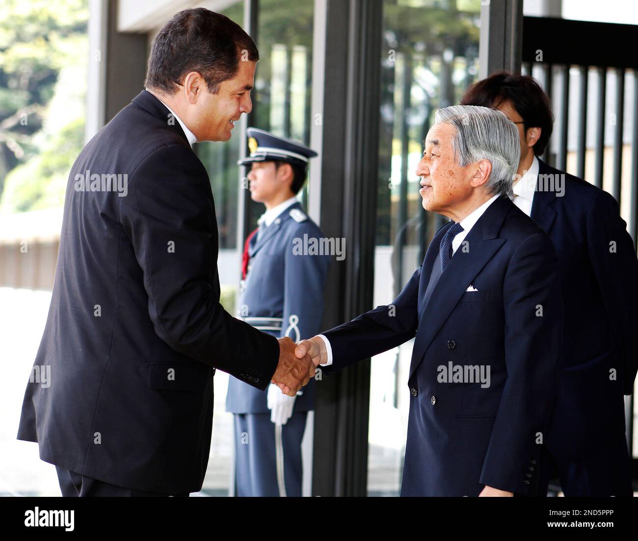 Ecuadoran President Rafael Correa is greeted by Japan's Emperor Akihito ...