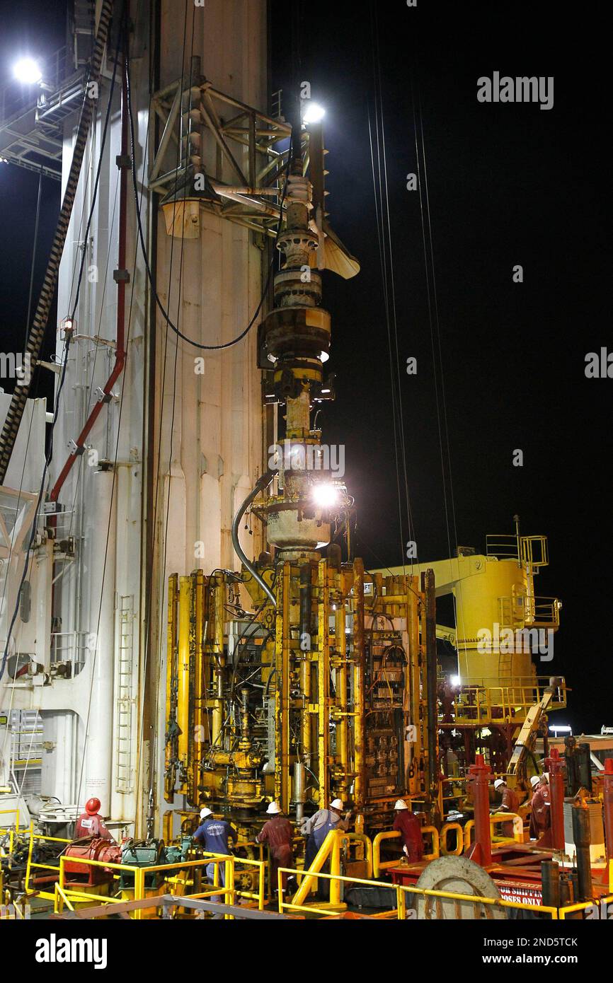 Workers watch as the Deepwater Horizon blowout preventer stack is ...