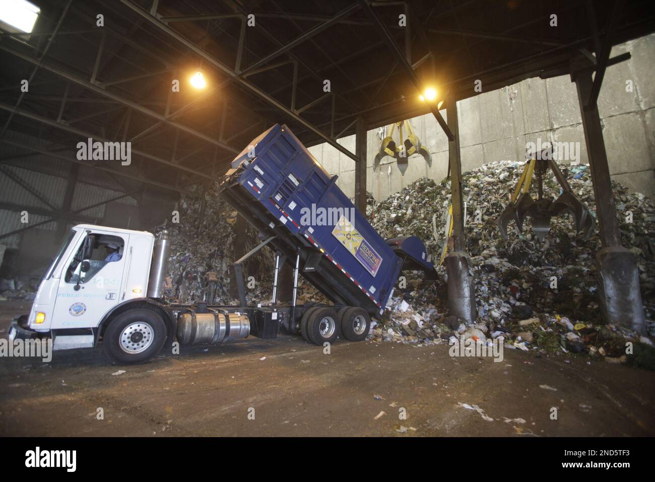 In this photo taken on Tuesday, Aug. 24, 2010, a trash truck discharges ...